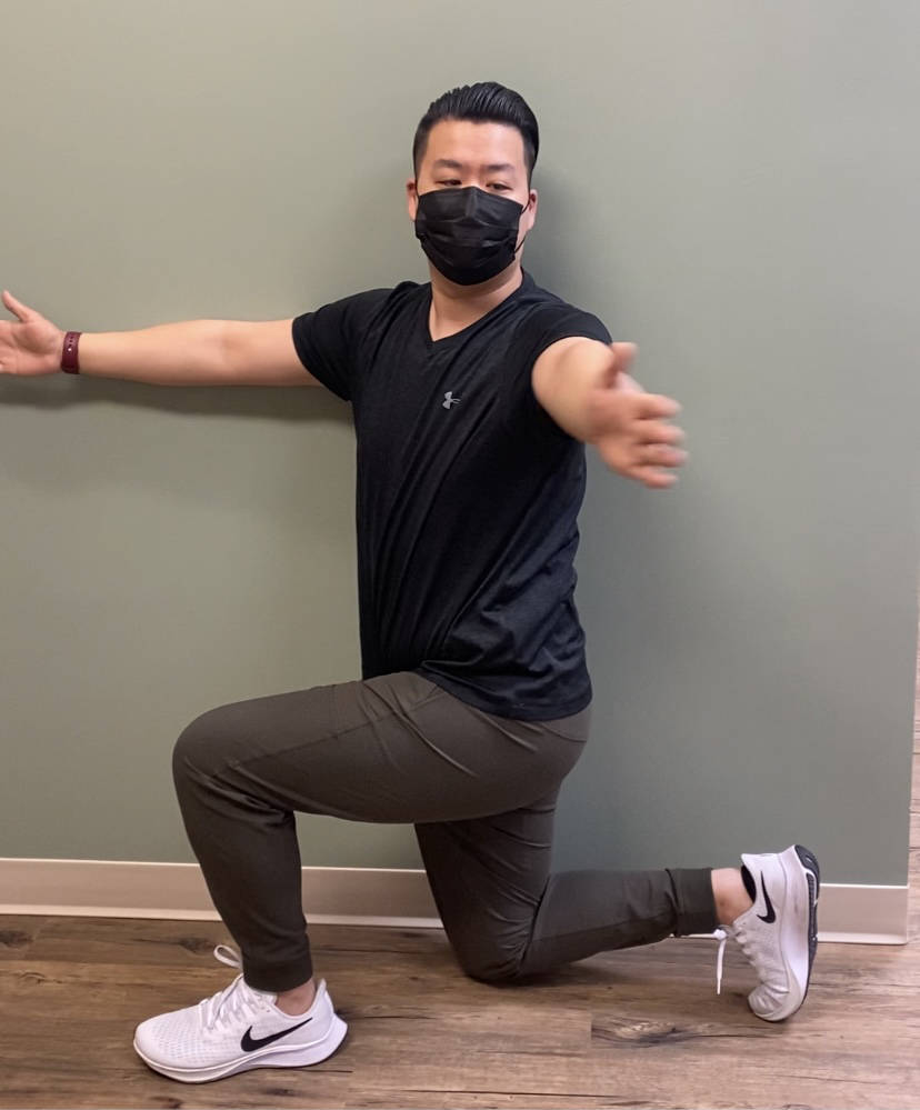 T-Spine rotations in half kneeling - Zen Physiotherapy